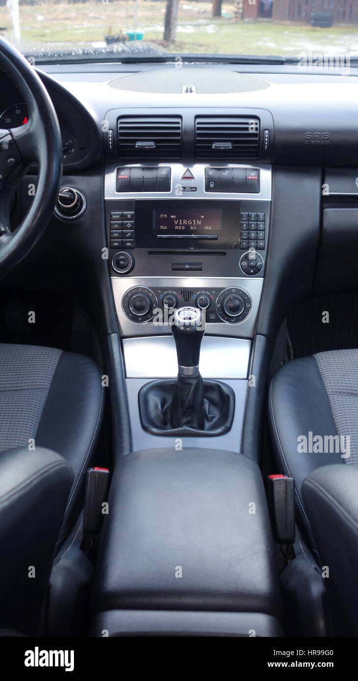 Mixed leather and textile upholstery car interior, big navigation ...