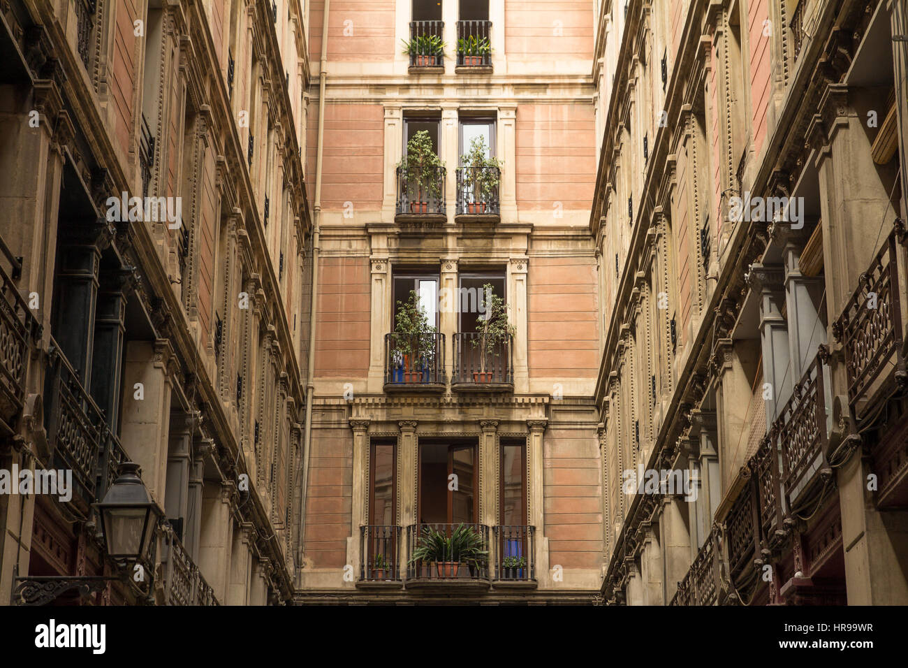house facade courtyard with balconies and windows Stock Photo - Alamy