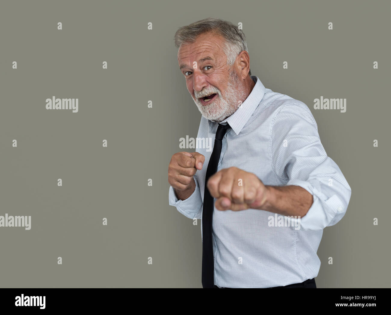 Old business man fighting hi-res stock photography and images - Alamy