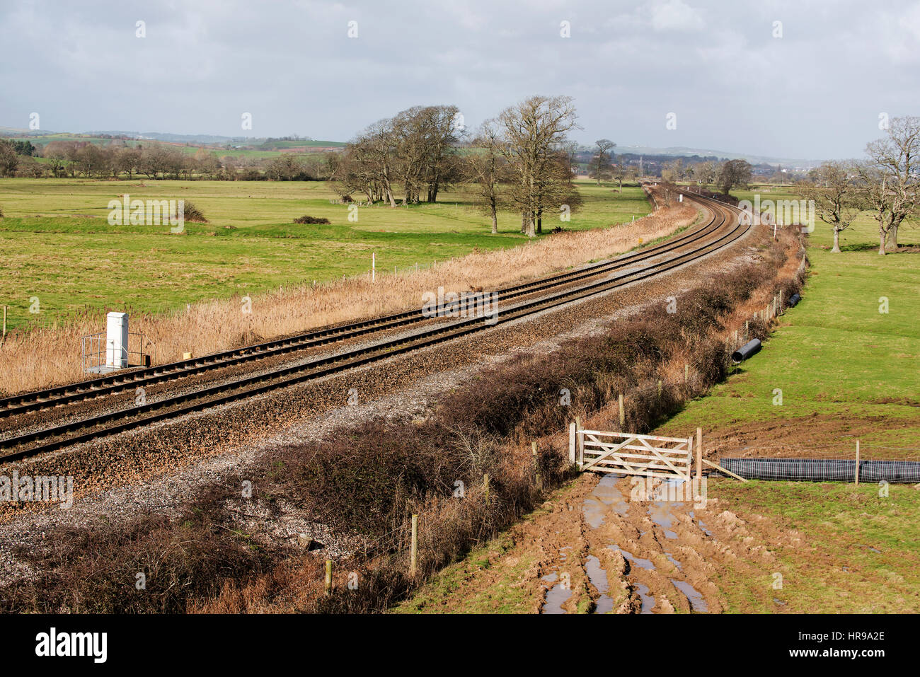 Railway lines crossing countryside on an embankment looking towards ...