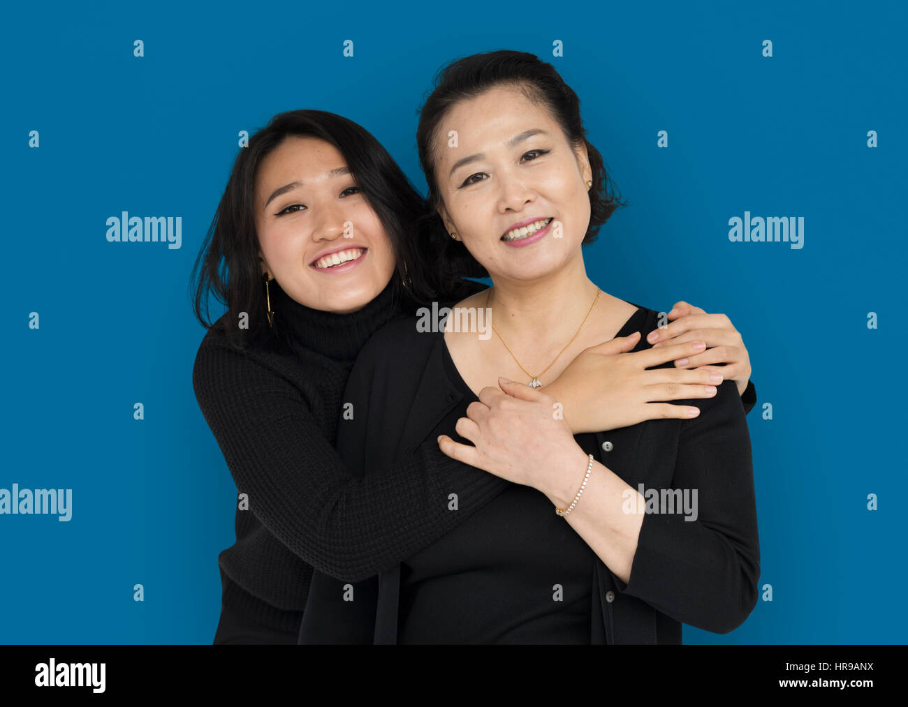 Asian Family Hug Smiling Stock Photo - Alamy