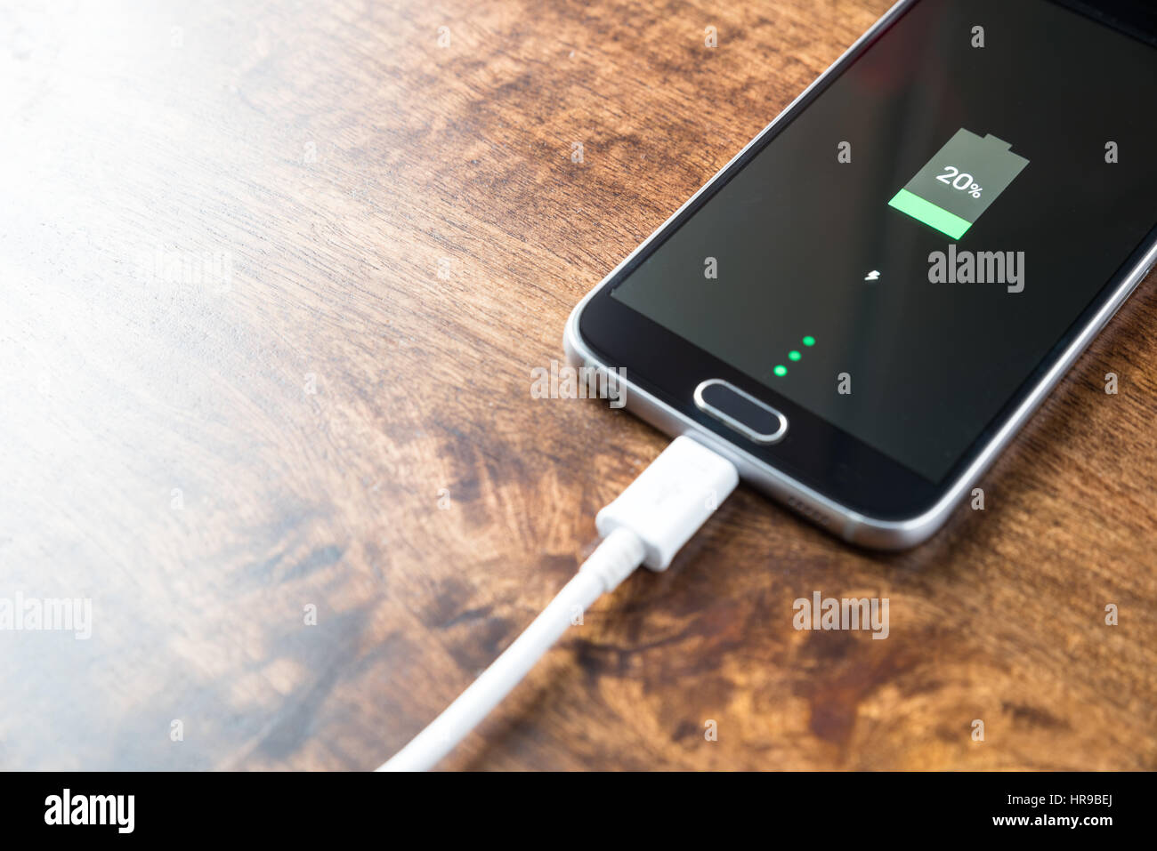 Close up view of smartphone charging battery Stock Photo - Alamy