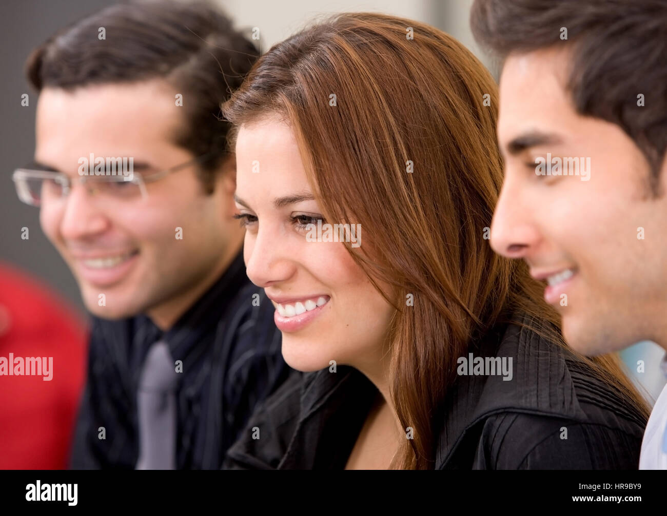 Small business team in an office smiling Stock Photo - Alamy
