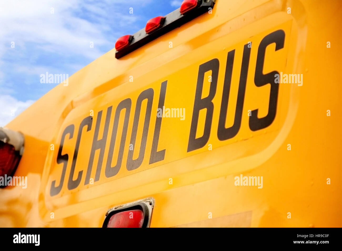 Back side of a yellow school bus Stock Photo - Alamy
