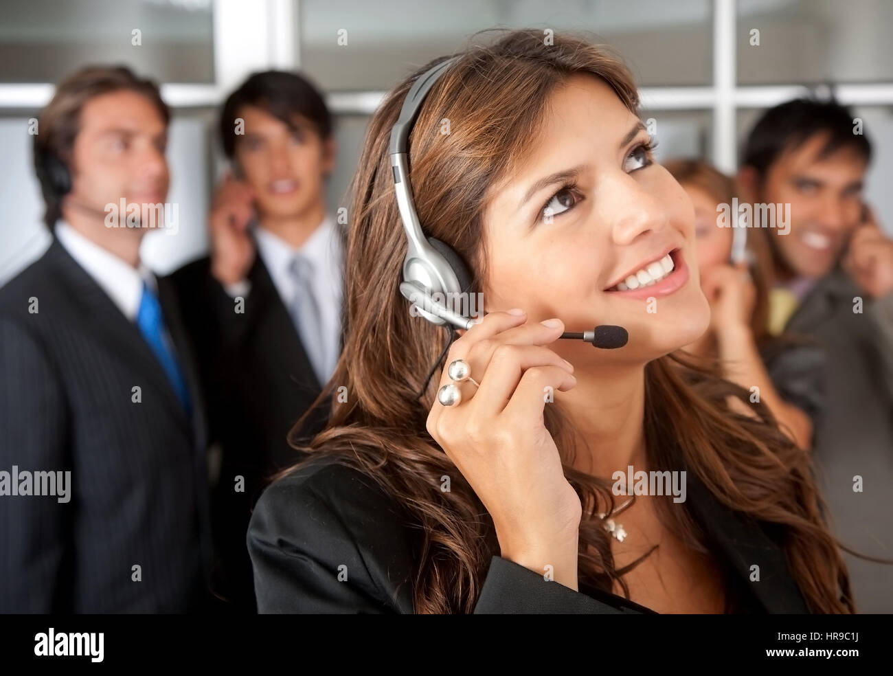 Customer services representative team in an office Stock Photo - Alamy