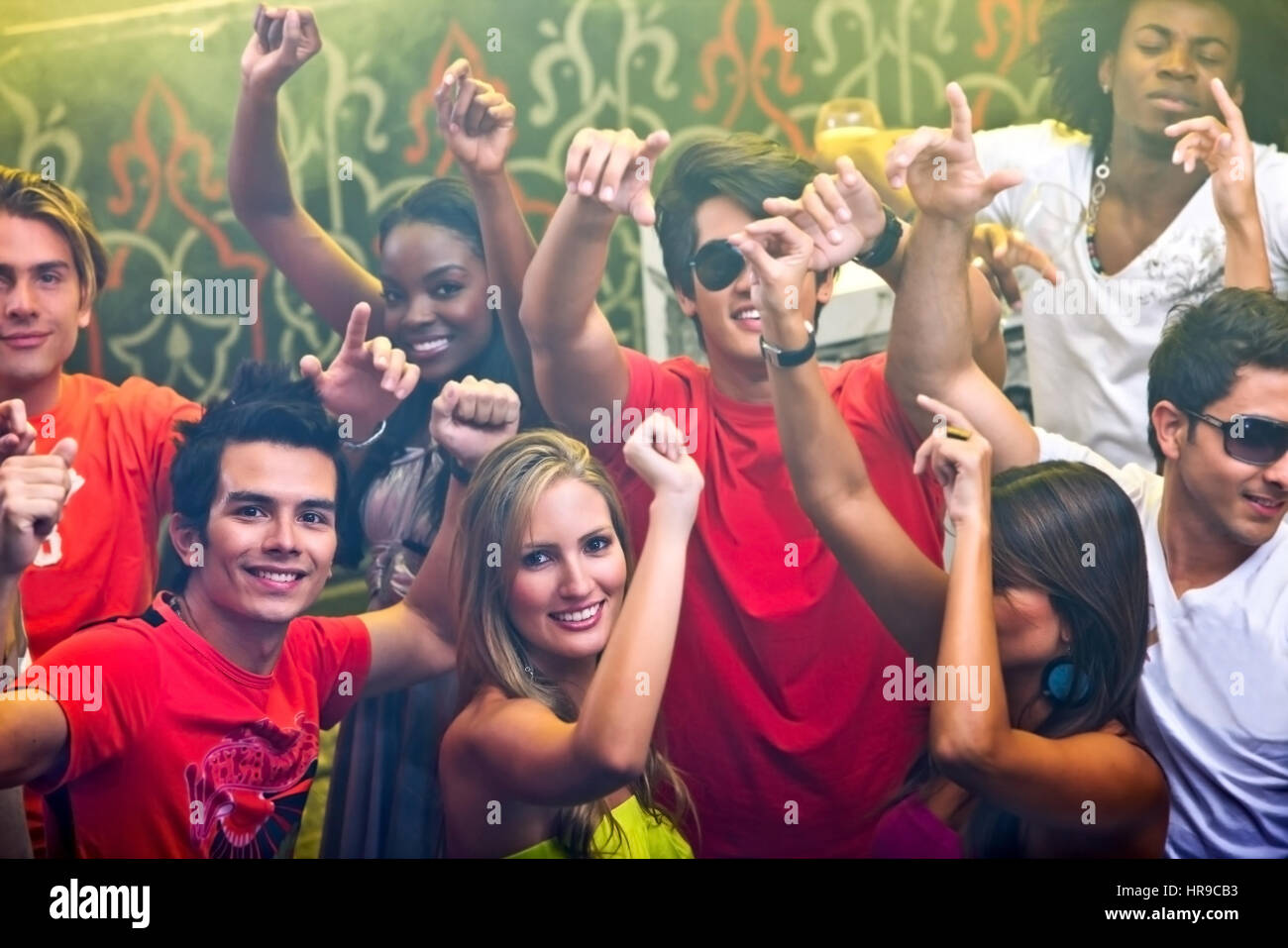 Group of happy friends at a bar or a nightclub Stock Photo - Alamy