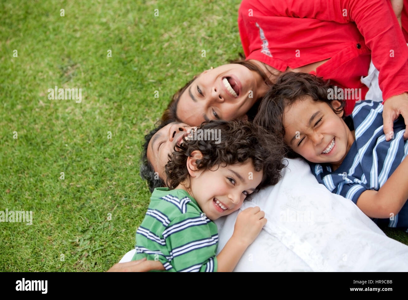 Beautiful happy family portrait smiling outdoors Stock Photo - Alamy