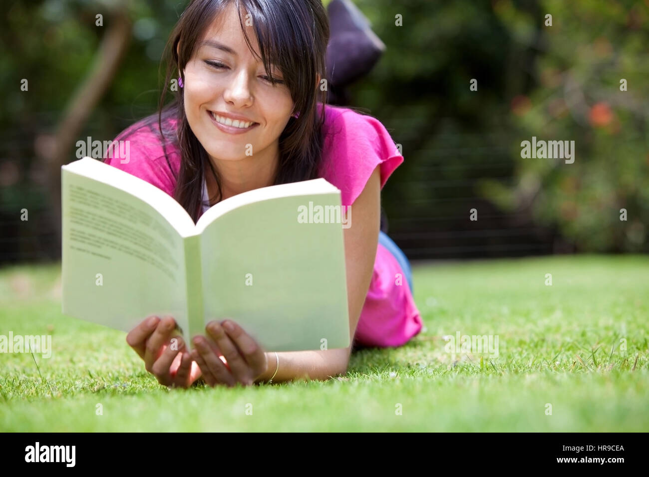 Beautiful woman enjoying book outdoors hi-res stock photography and ...