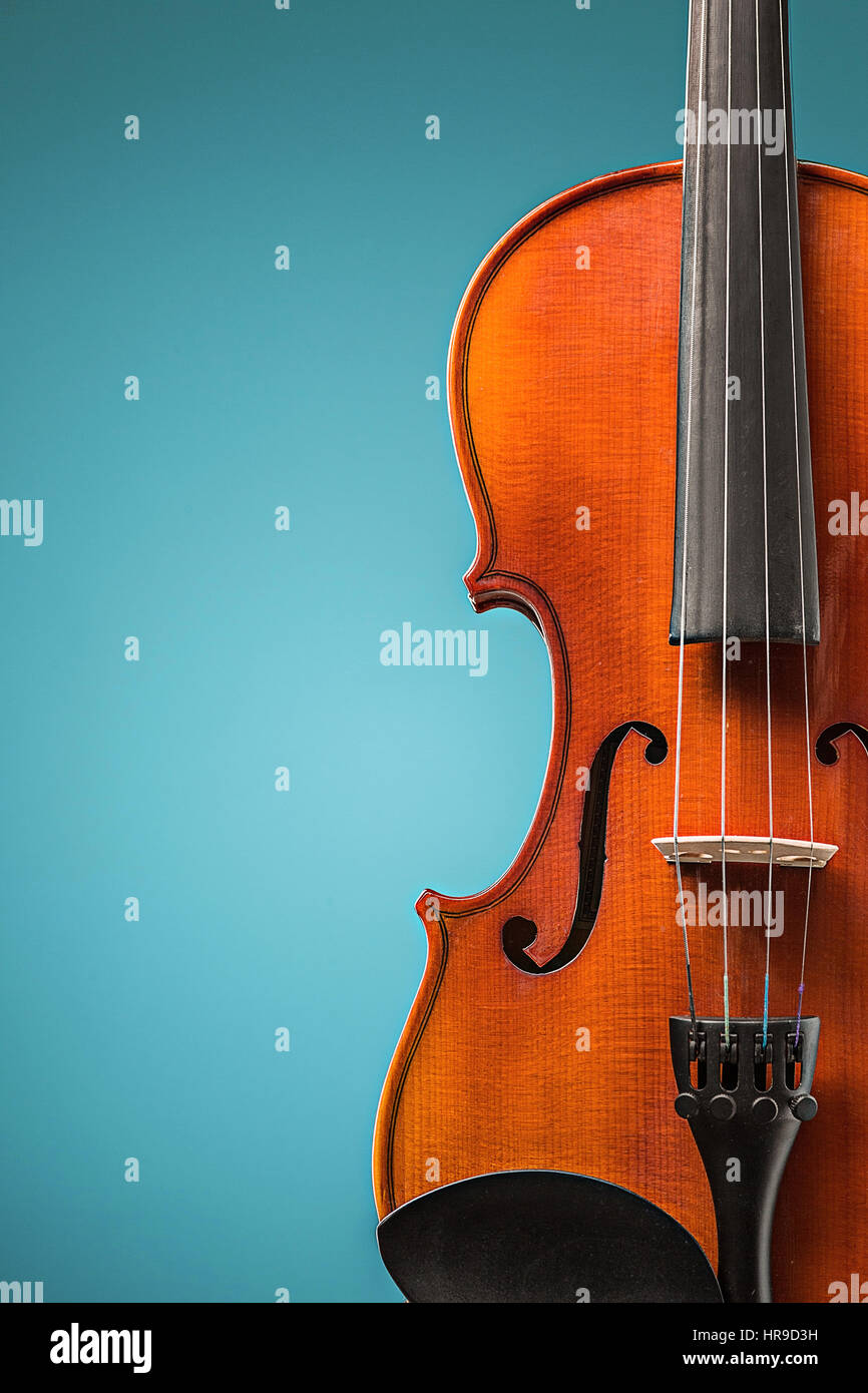 Violin front view on blue studio background Stock Photo - Alamy