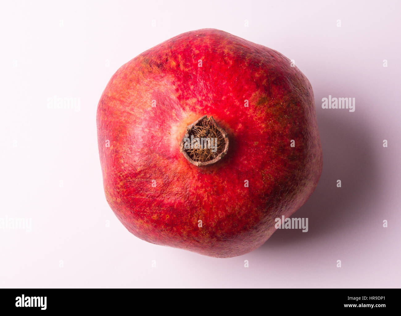 Big Pomegranate fruit on white background, closeup Stock Photo - Alamy