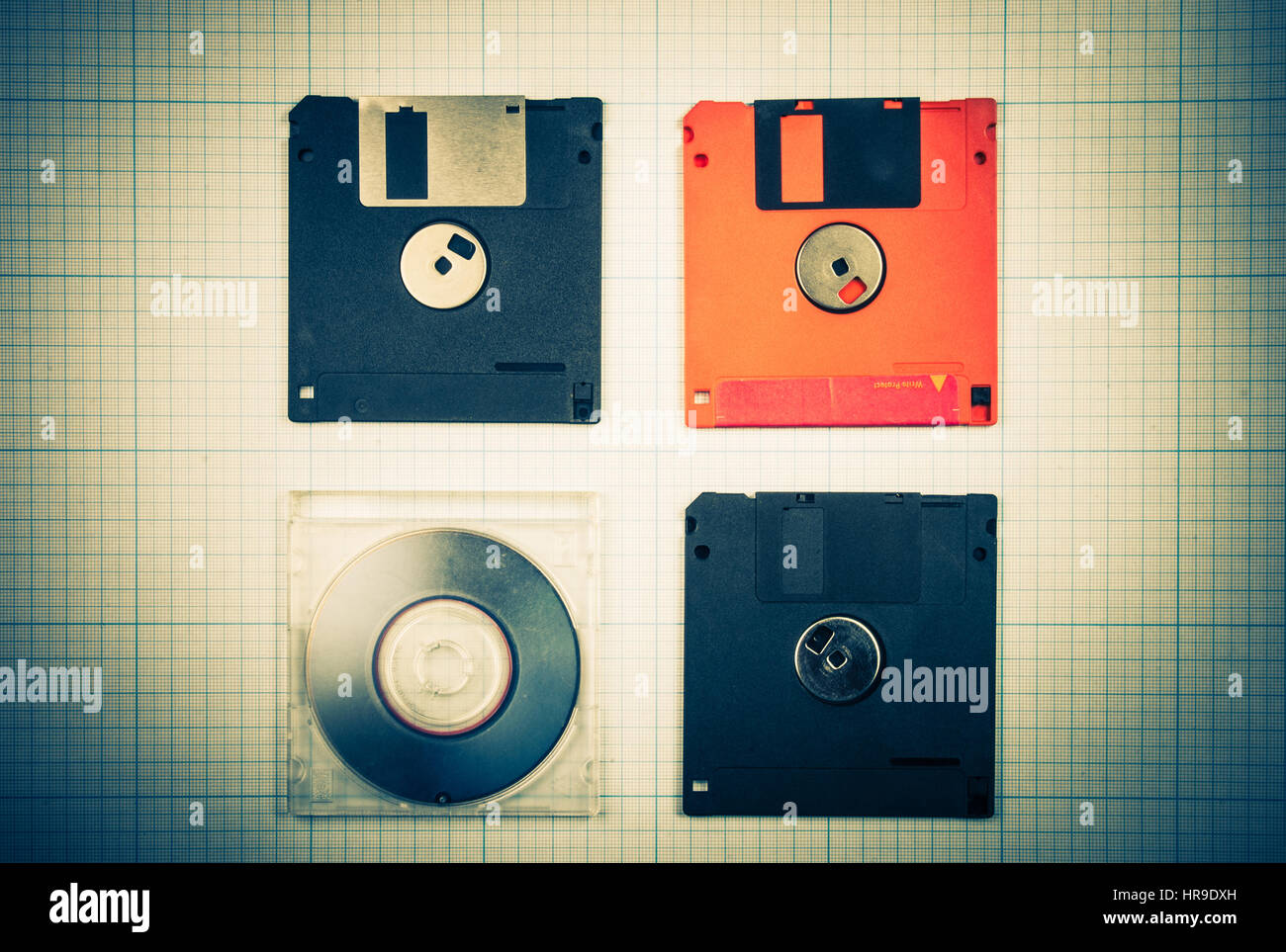 vintage background - computer floppy disks and mini-CD on the blueprint ...