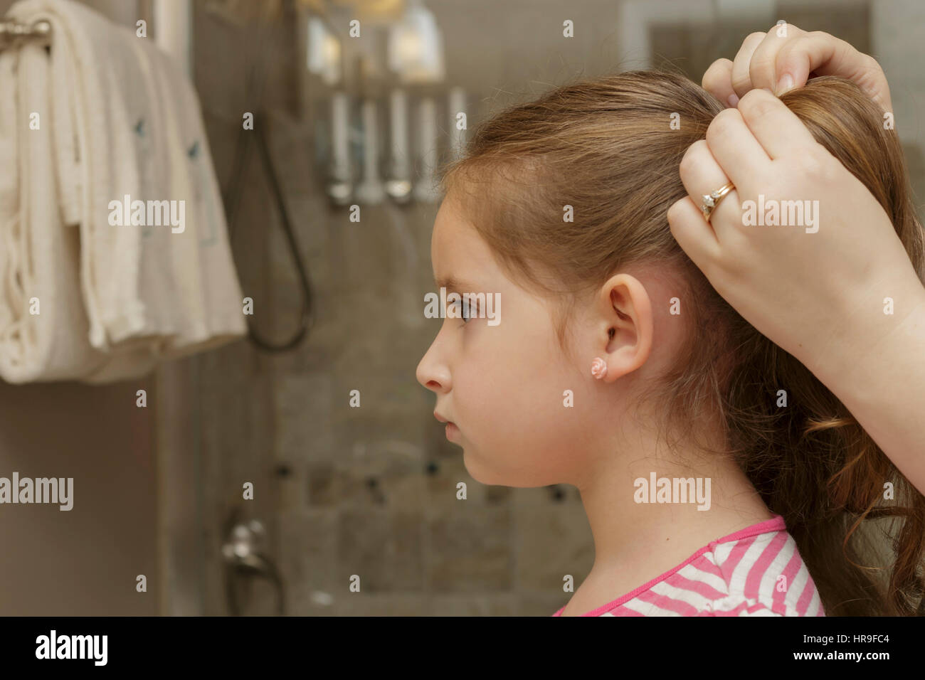 girl getting her hair fixed Stock Photo - Alamy