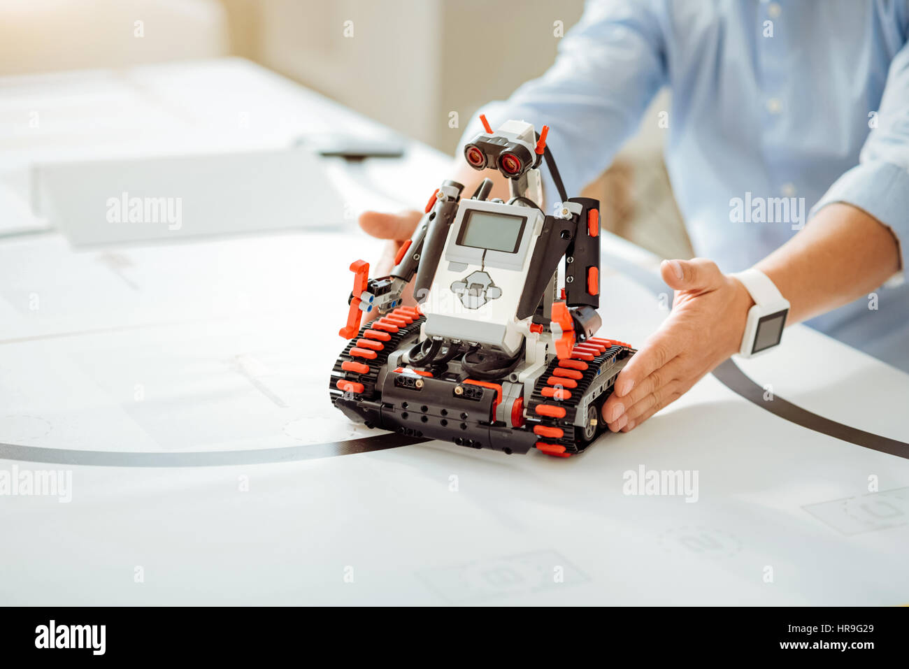 Modern robot standing on the table Stock Photo - Alamy