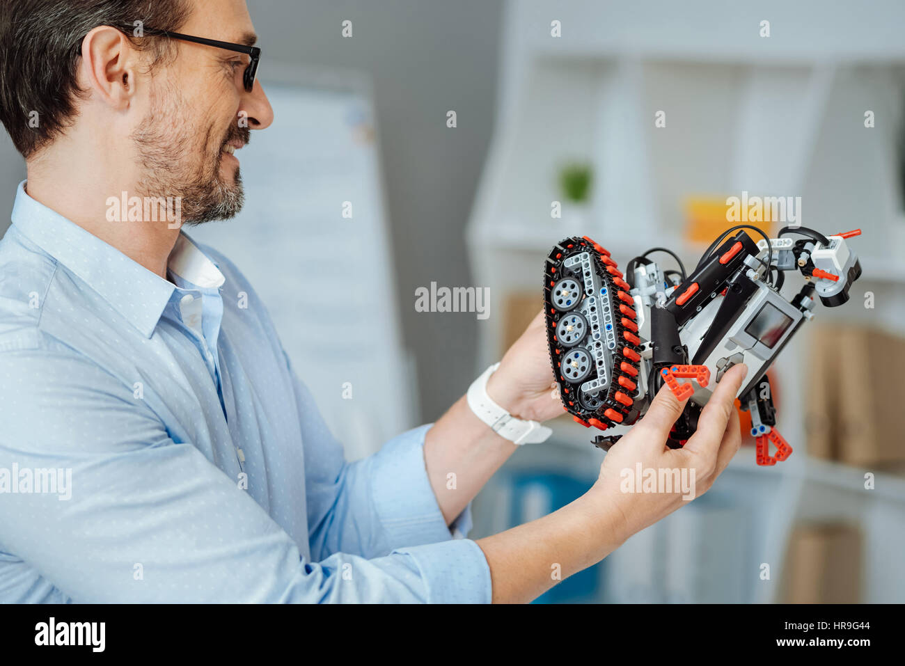 Cheerful engineer working in a lab Stock Photo - Alamy