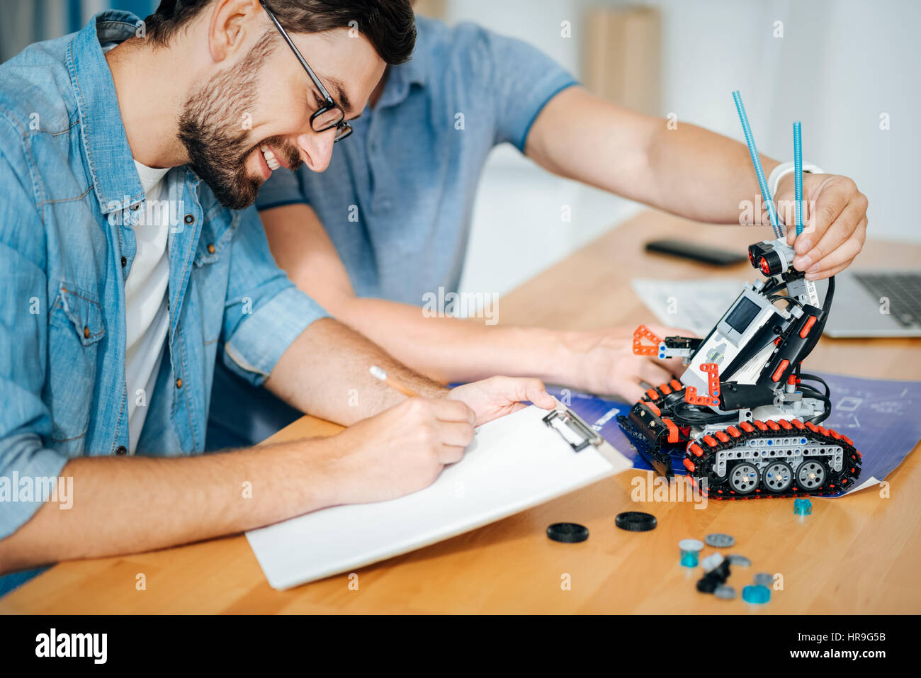 Professionals engineers working together Stock Photo - Alamy