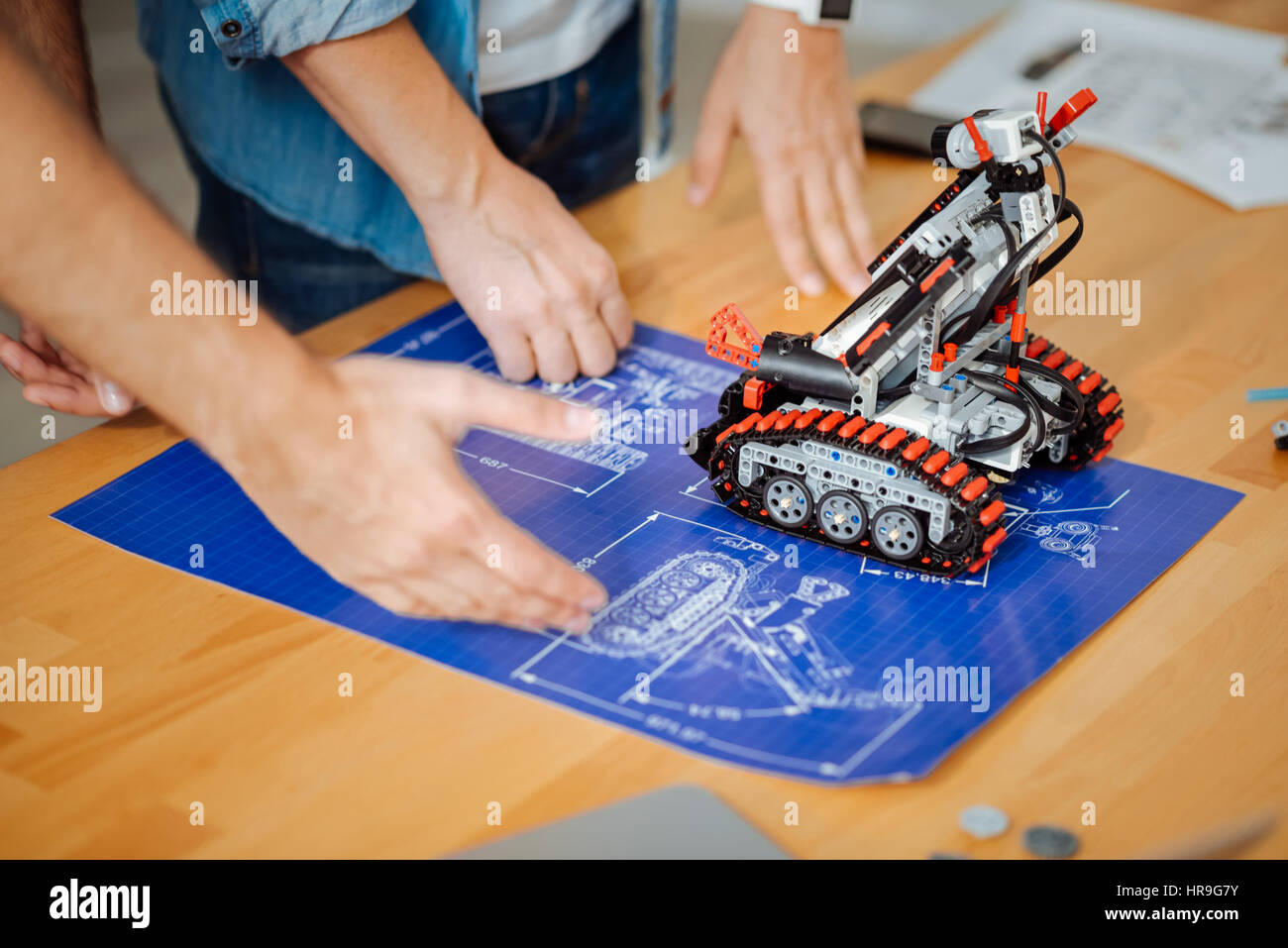 Professional engineers working in the field of robotic technologies ...