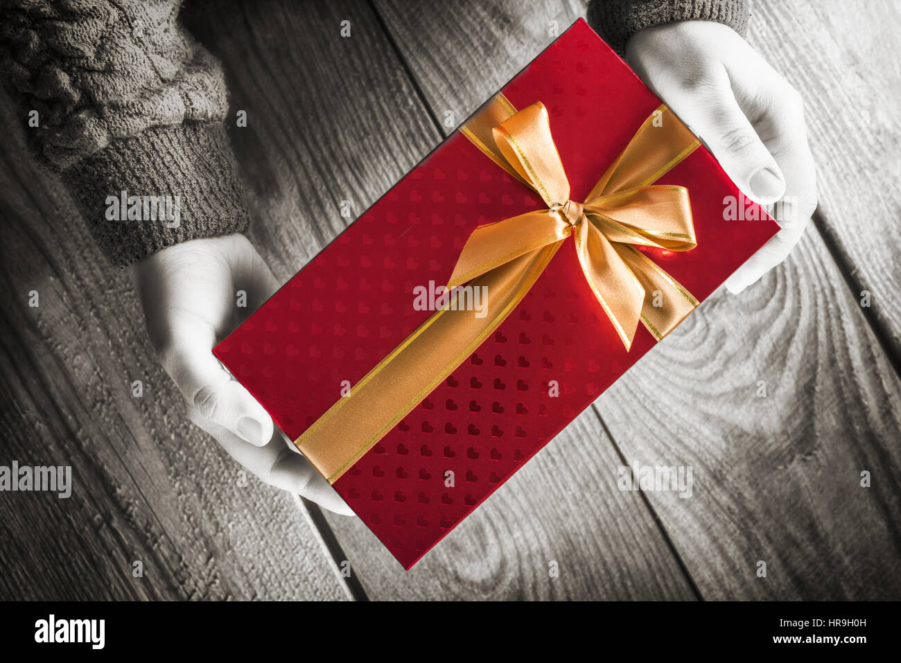Gift box in hands Stock Photo - Alamy