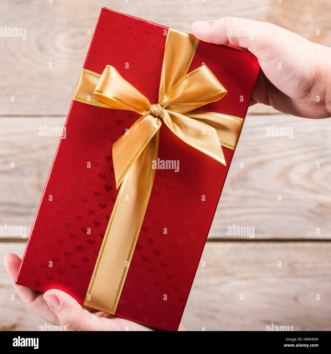 Gift box in hands Stock Photo - Alamy