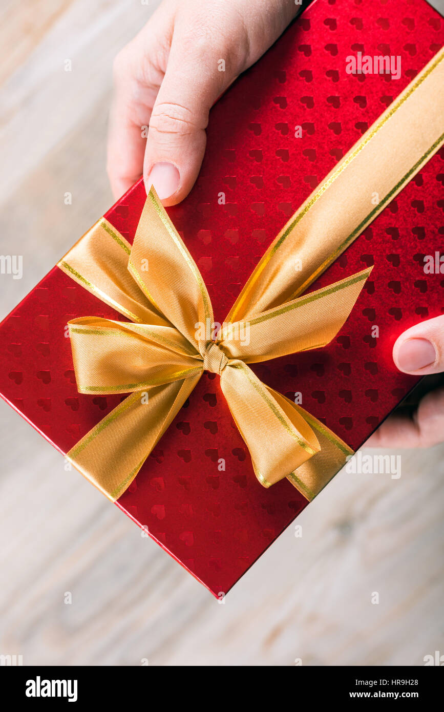 Gift box in hands Stock Photo - Alamy