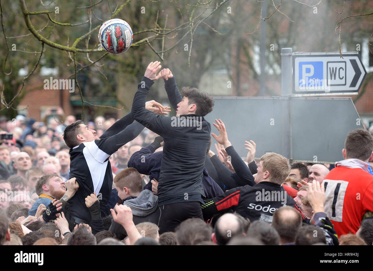 Players during the Royal Shrovetide Football match in Ashbourne ...