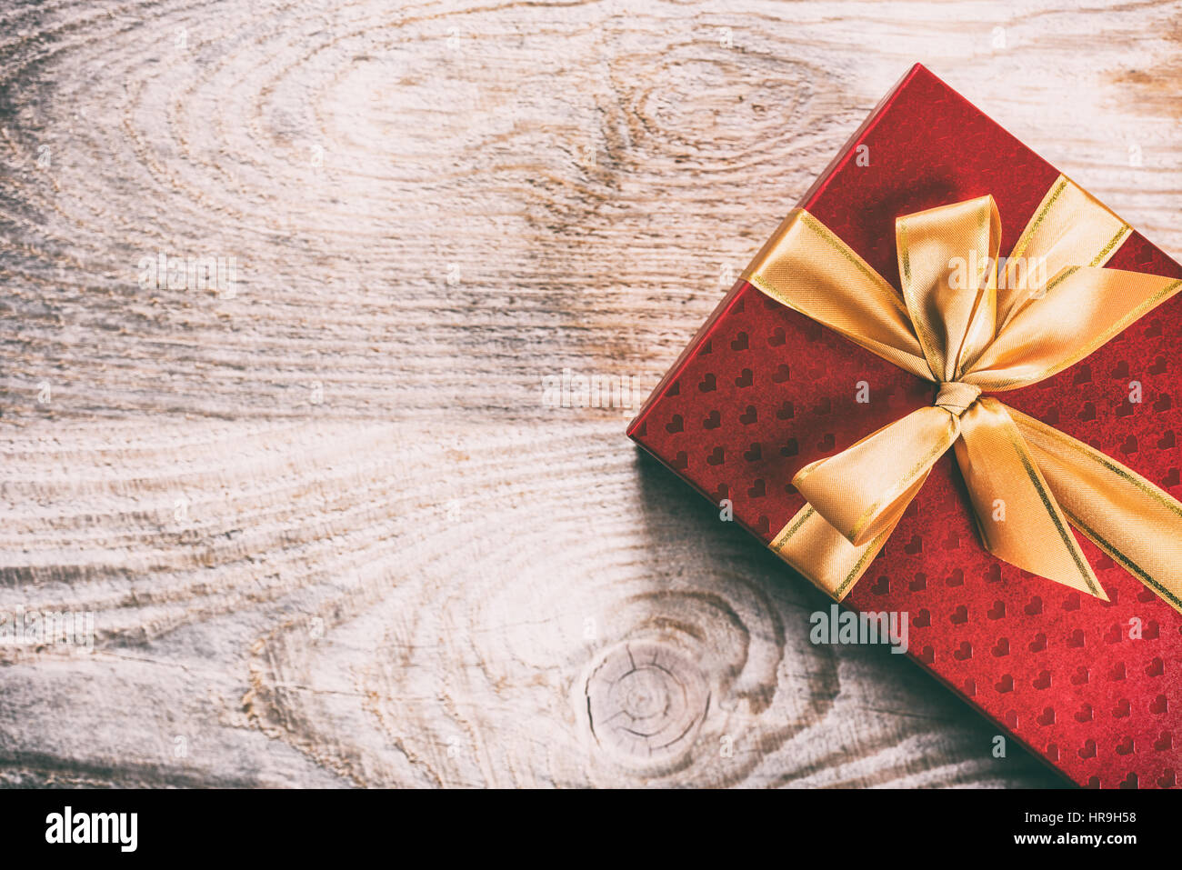 Red gift box with gold ribbon Stock Photo - Alamy
