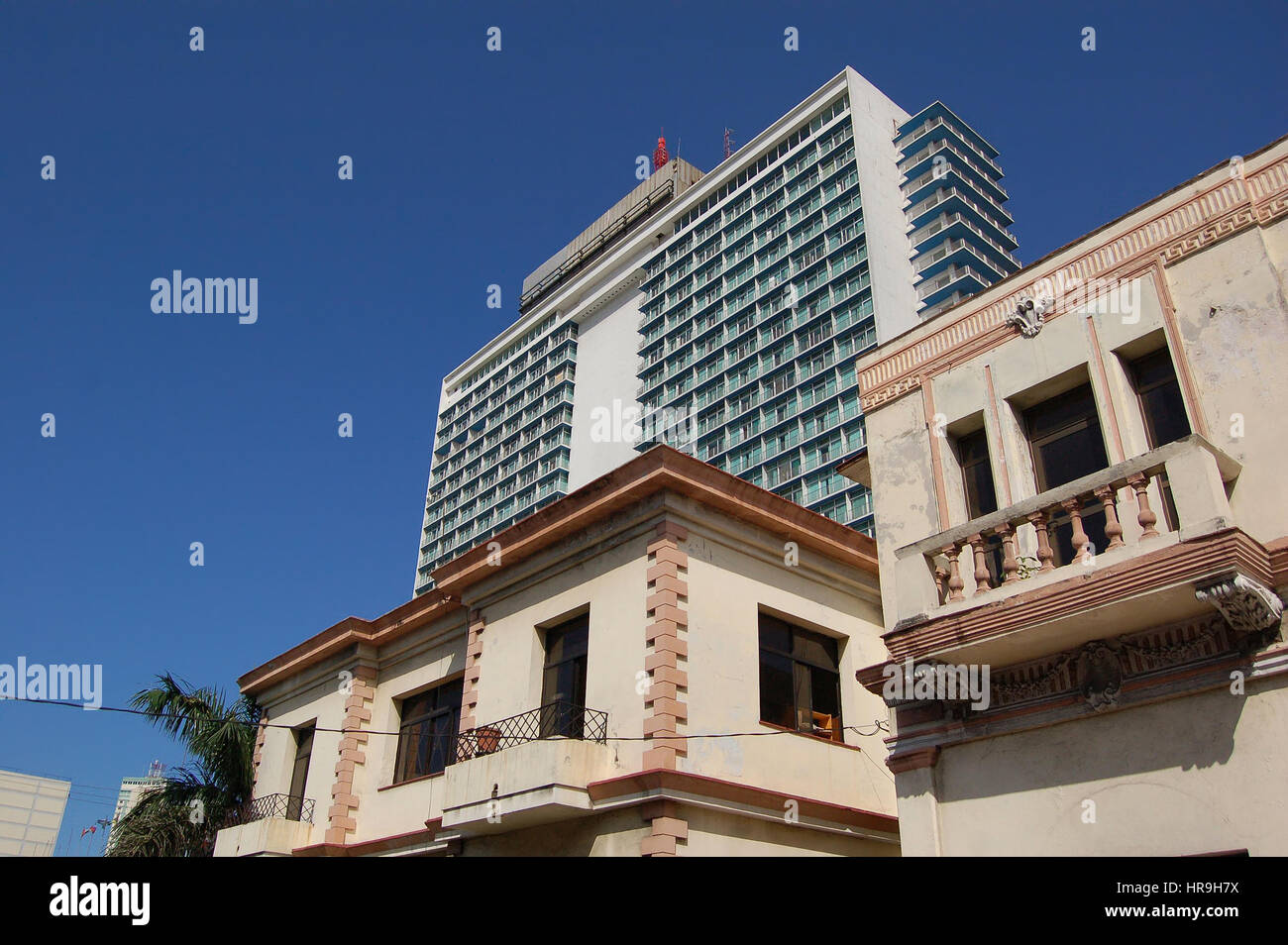 View of the Hotel Habana Hilton rising above neighbouring residences ...