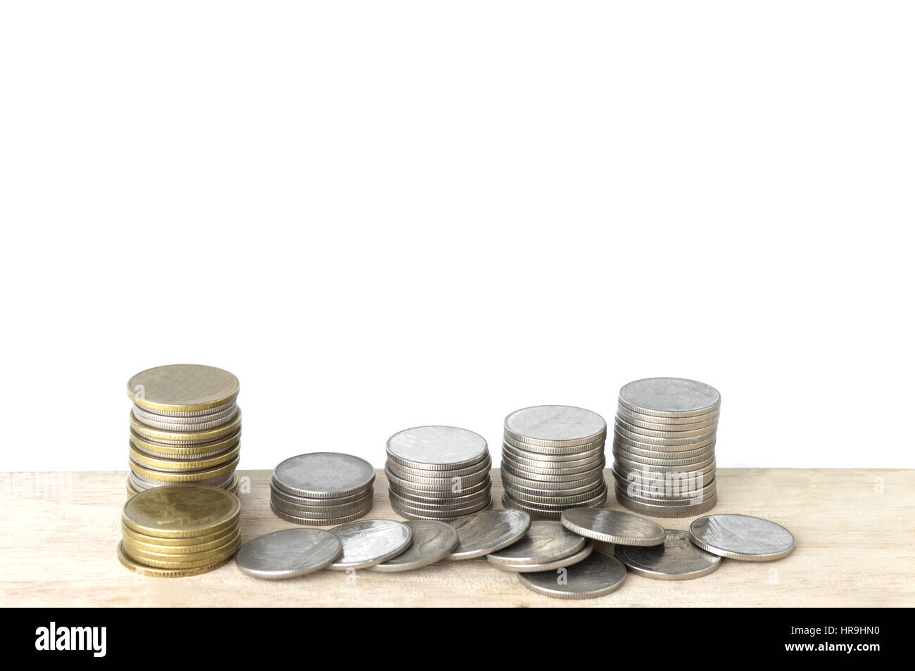 silver coin stack and tree in concept of growth in an isolated ...