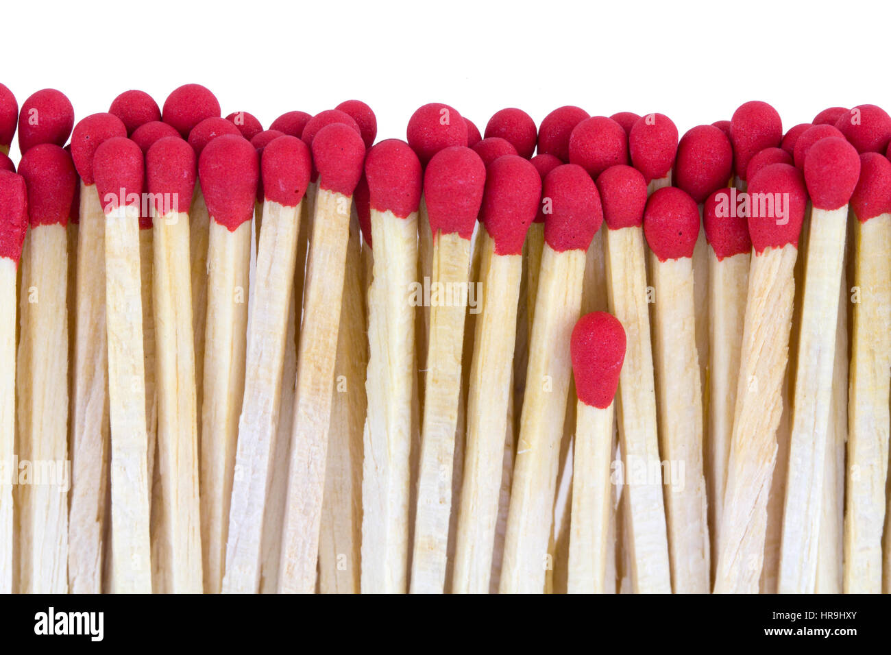 Group of matches in white background with only one match in lower level ...