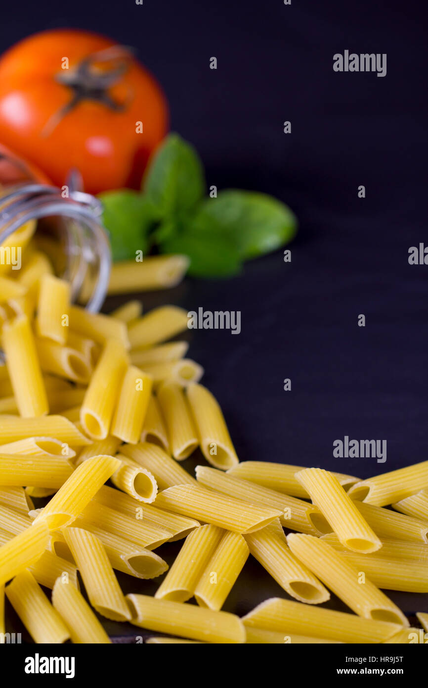 Italian Penne Rigate Macaroni Pasta with tomato and basil isolated on ...