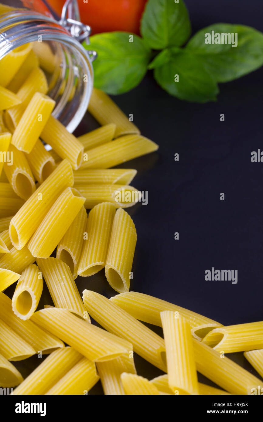 Italian Penne Rigate Macaroni Pasta with tomato and basil isolated on ...