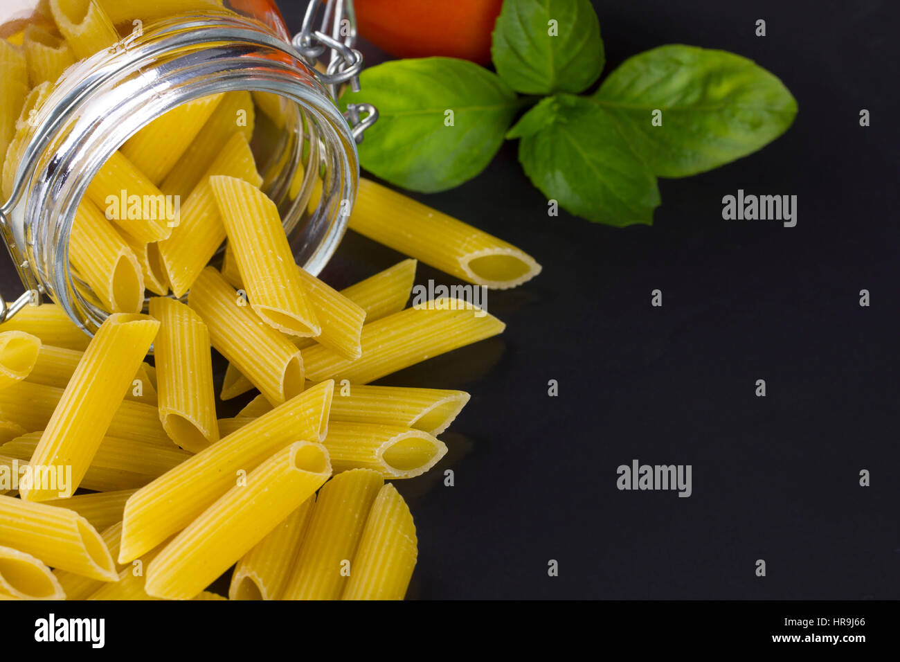Italian Penne Rigate Macaroni Pasta with tomato and basil isolated on ...