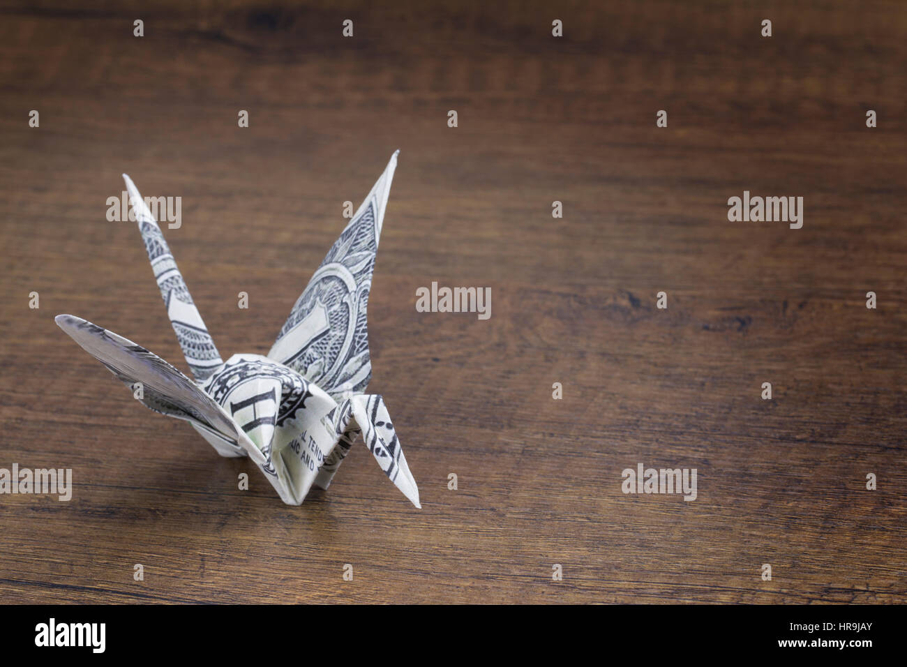 Money Origami Birds Isolated on Wooden Background Stock Photo - Alamy