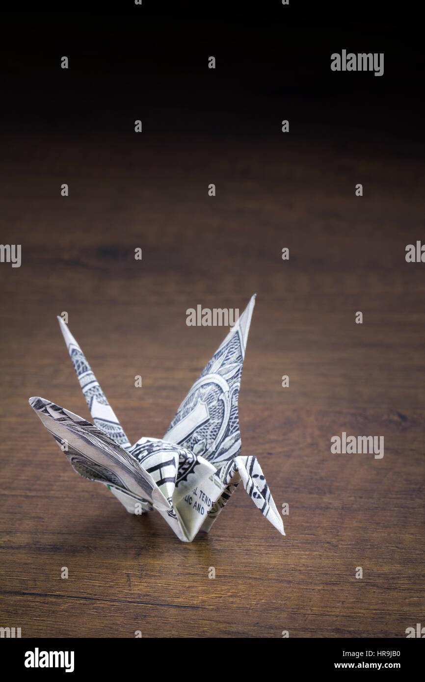 Money Origami Birds Isolated on Wooden Background Stock Photo - Alamy