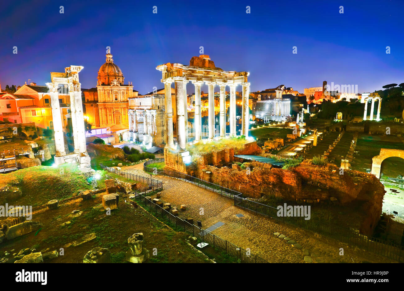View of the roman ruins at night in Rome, Italy Stock Photo - Alamy