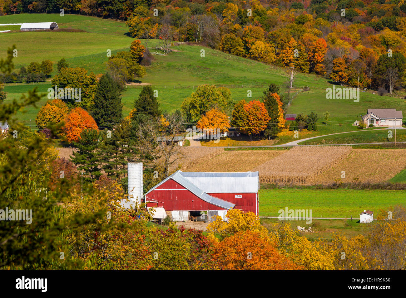 Amish farms in a valley with fall foliage color near Walnut Creek, Ohio ...