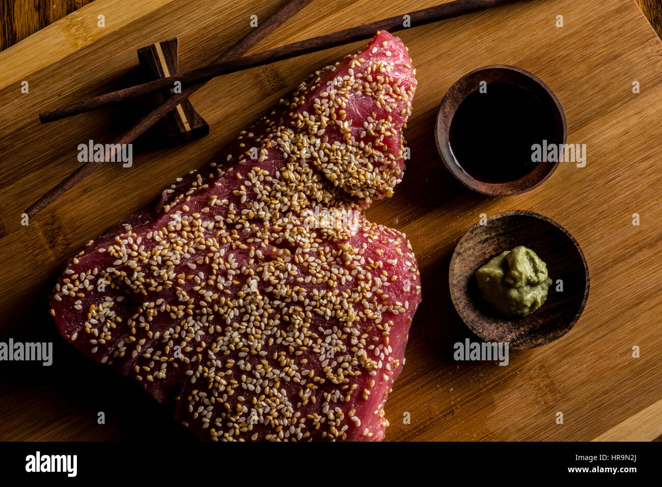 raw tuna fish with sesame seeds ready to cook Stock Photo - Alamy