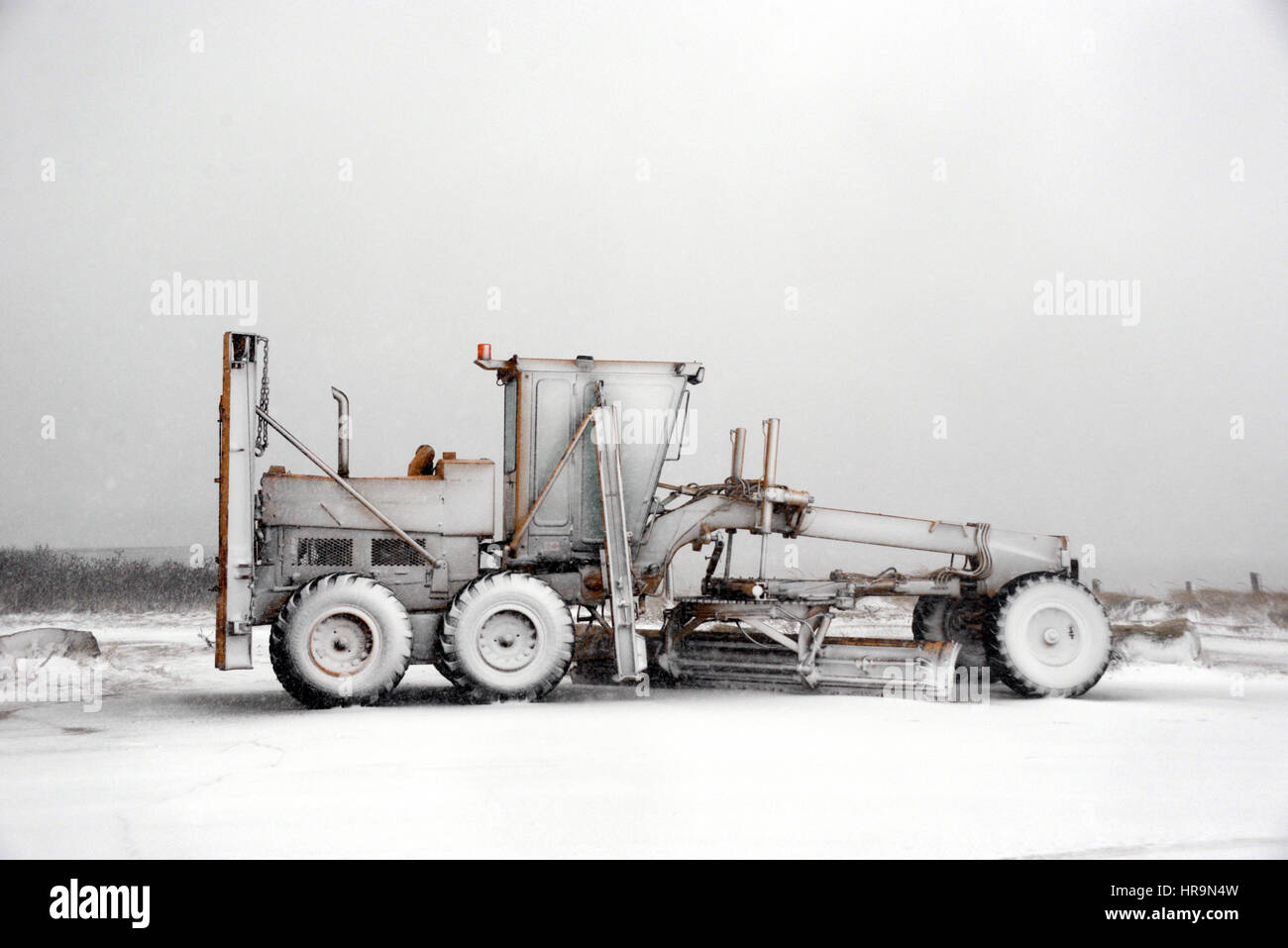 snow covered tracker by the bay Stock Photo - Alamy