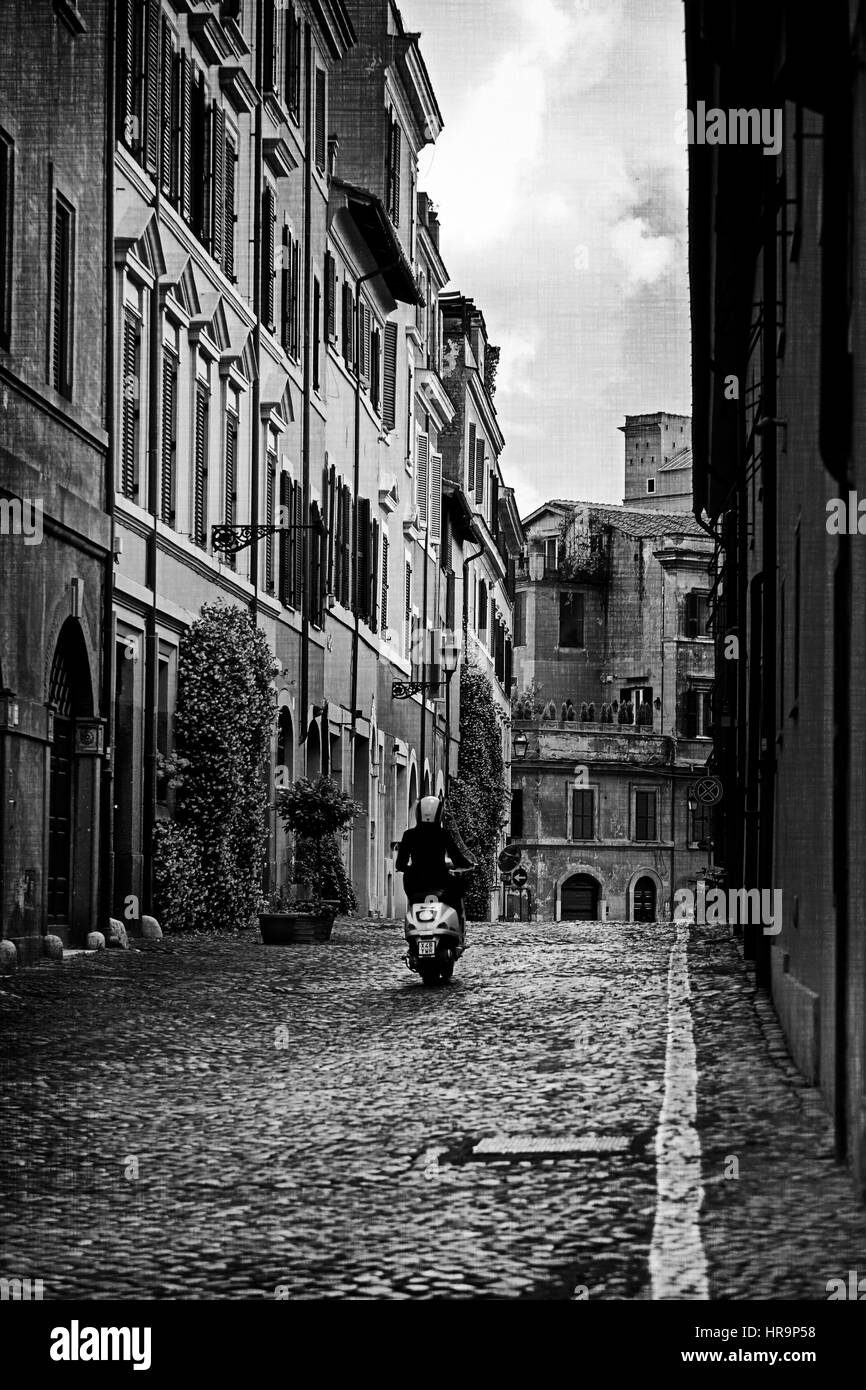 A picturesque cobbled side street in Rome, Italy. A textured image ...