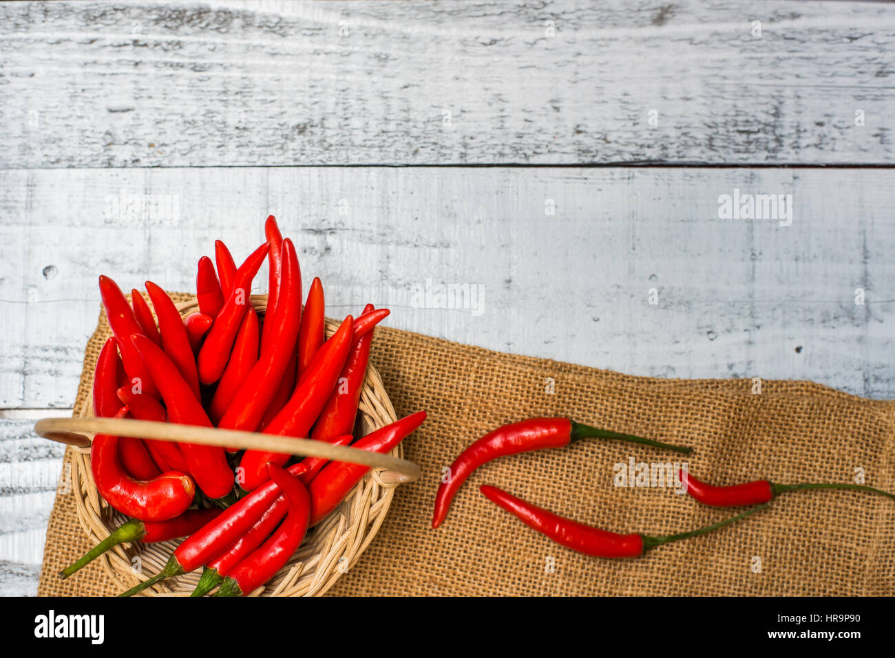 Hot and spicy red chilli on wood table background Stock Photo - Alamy