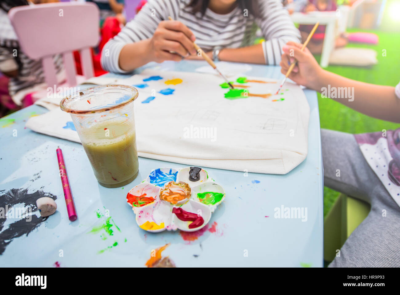Education, Mixing Water Colors in a painting Class Stock Photo - Alamy