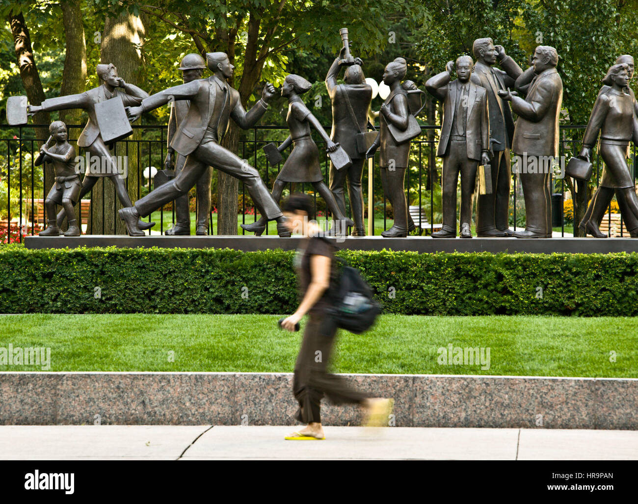Woman walking by statue in Toronto Canada Stock Photo - Alamy