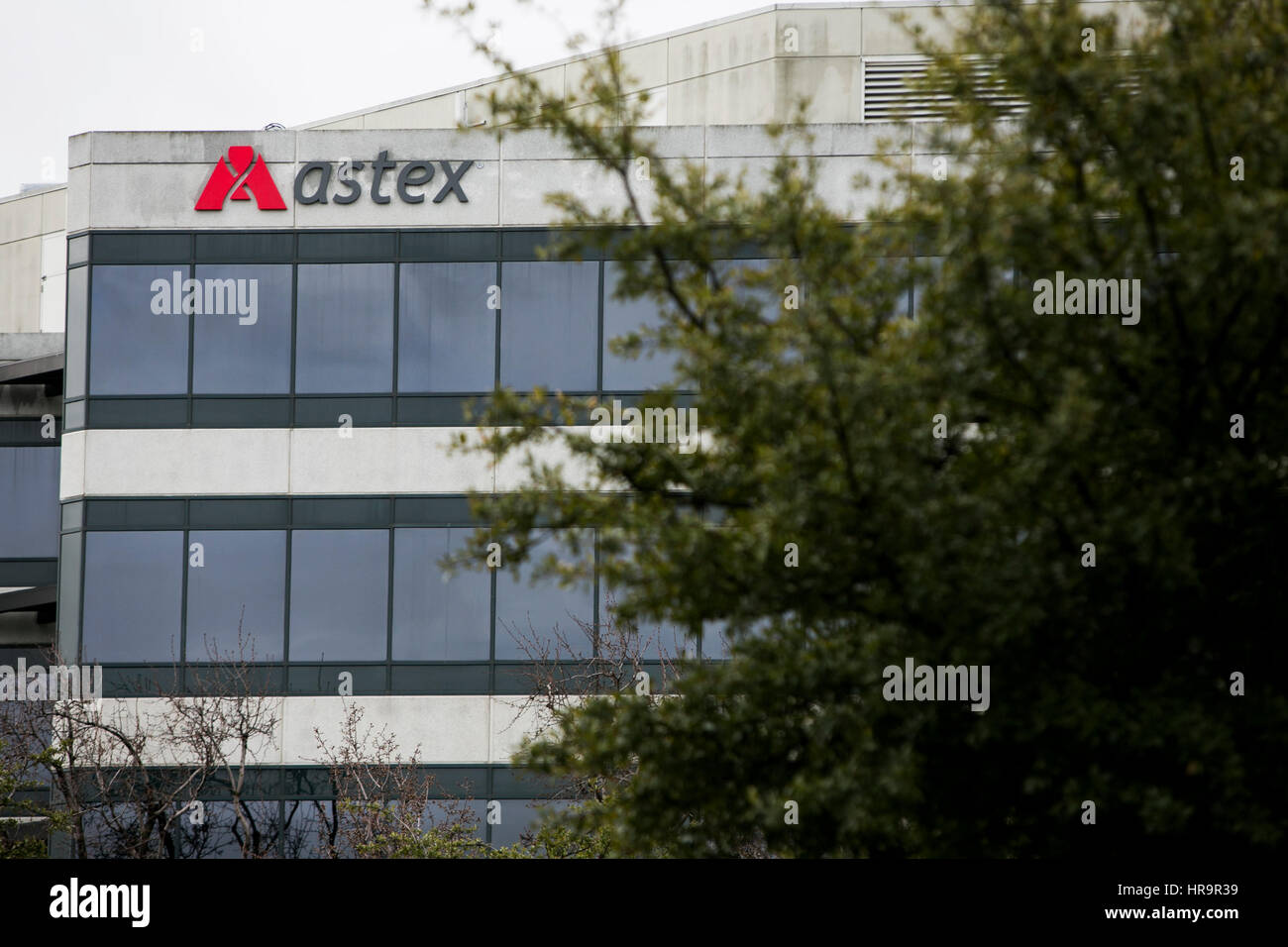 A logo sign outside of the headquarters of Astex Pharmaceuticals in ...