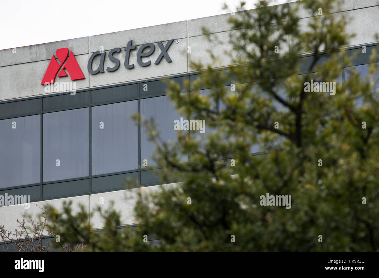A logo sign outside of the headquarters of Astex Pharmaceuticals in ...