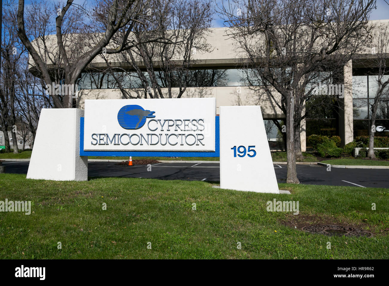 A logo sign outside of the headquarters of Cypress Semiconductor in San ...
