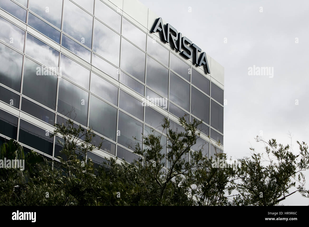A logo sign outside of the headquarters of Arista Networks in Santa ...