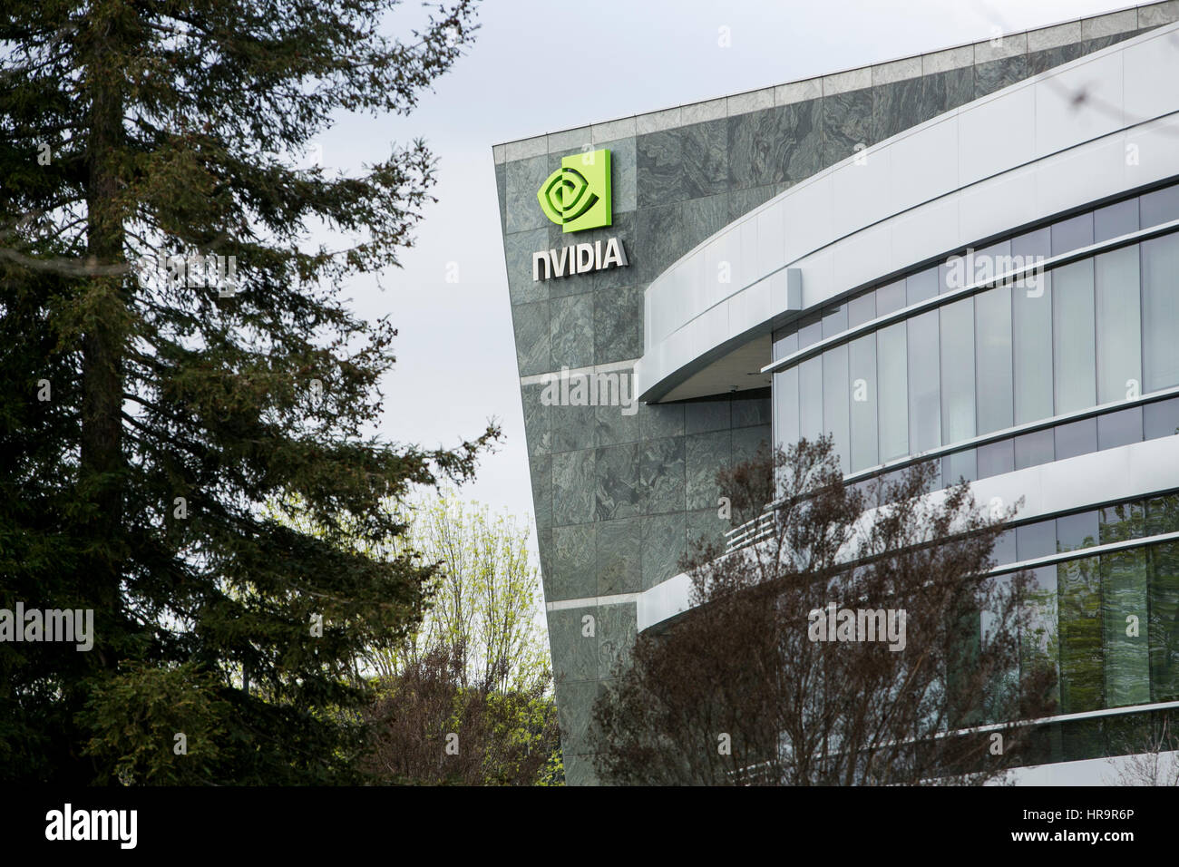 A logo sign outside of the headquarters of the Nvidia Corporation in ...
