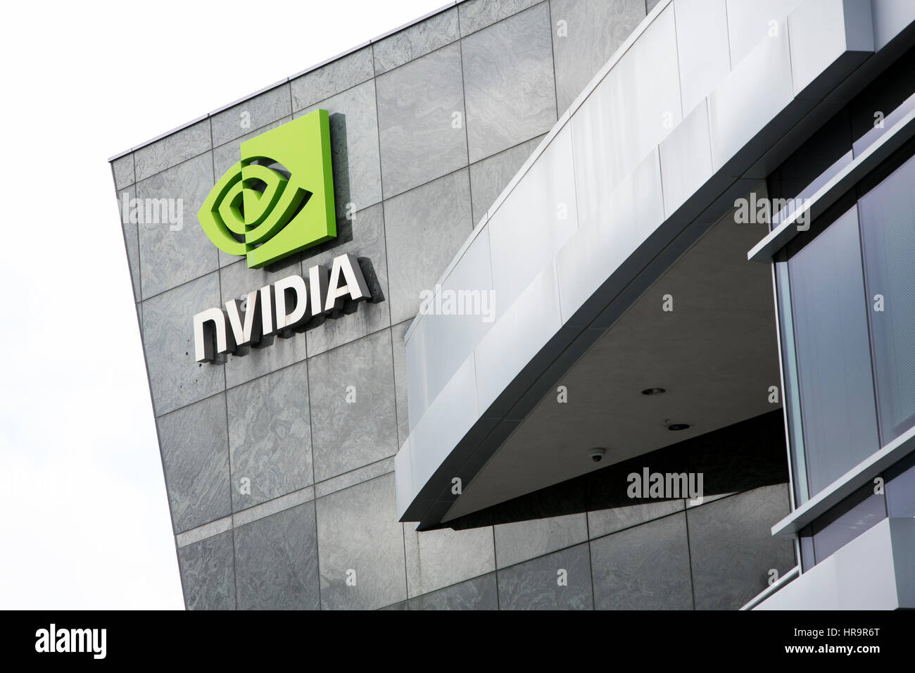 A logo sign outside of the headquarters of the Nvidia Corporation in ...