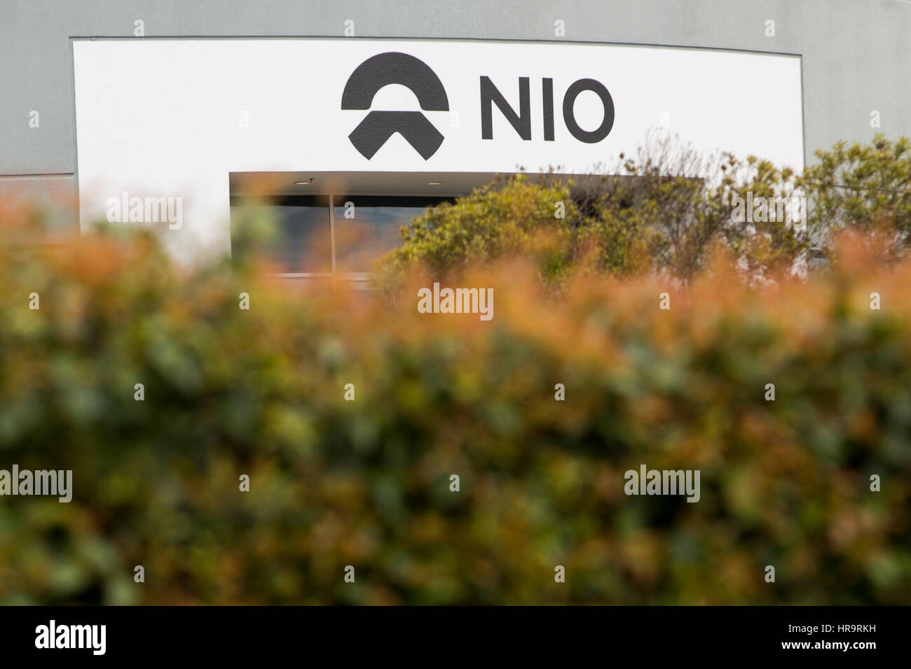 A logo sign outside of a facility occupied by NIO and NextEV in San ...