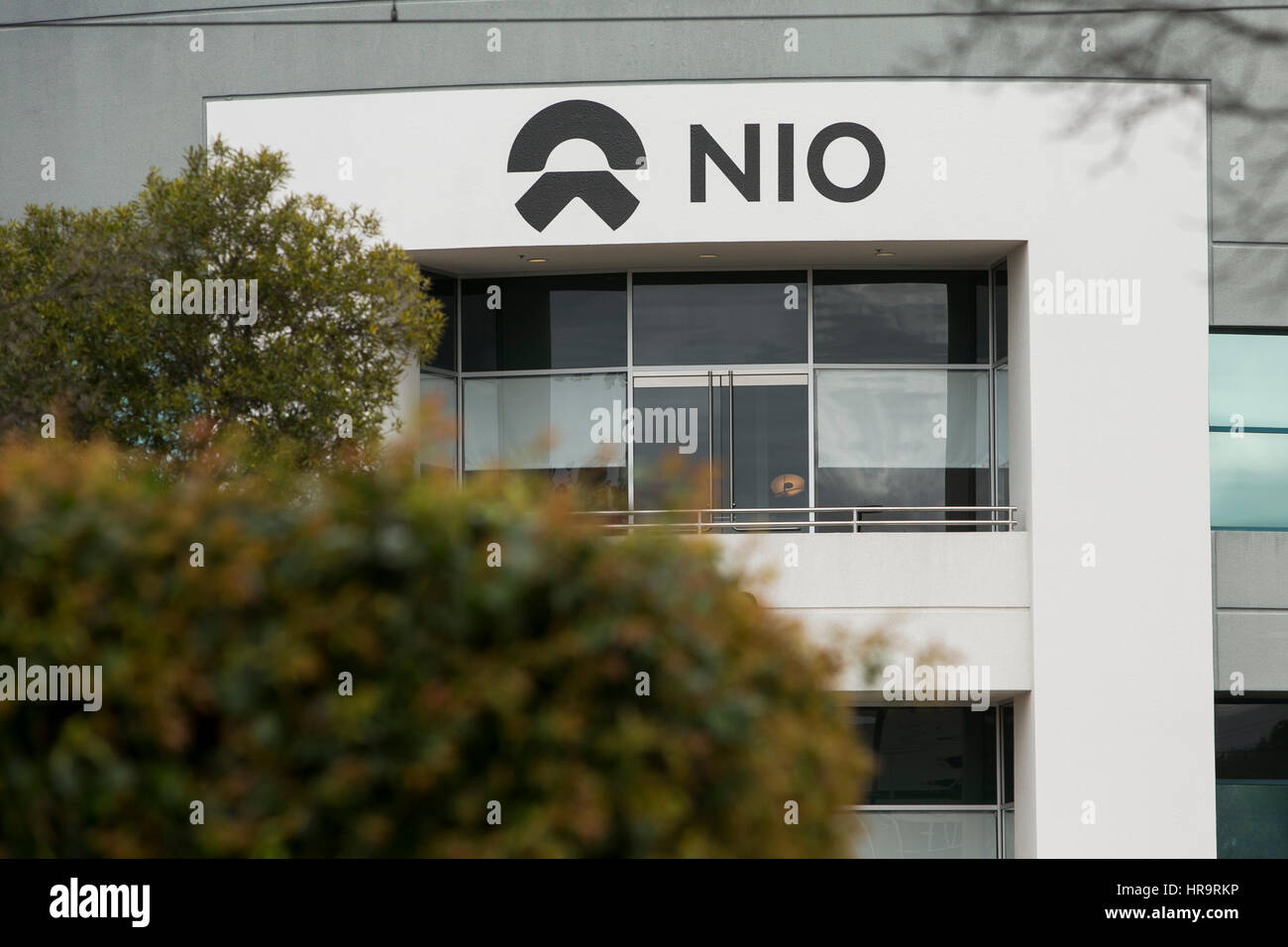 A logo sign outside of a facility occupied by NIO and NextEV in San ...