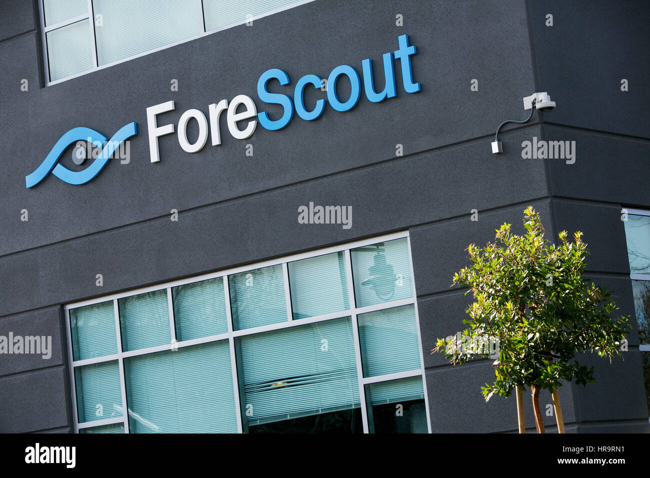 A logo sign outside of a facility occupied by ForeScout Technologies ...